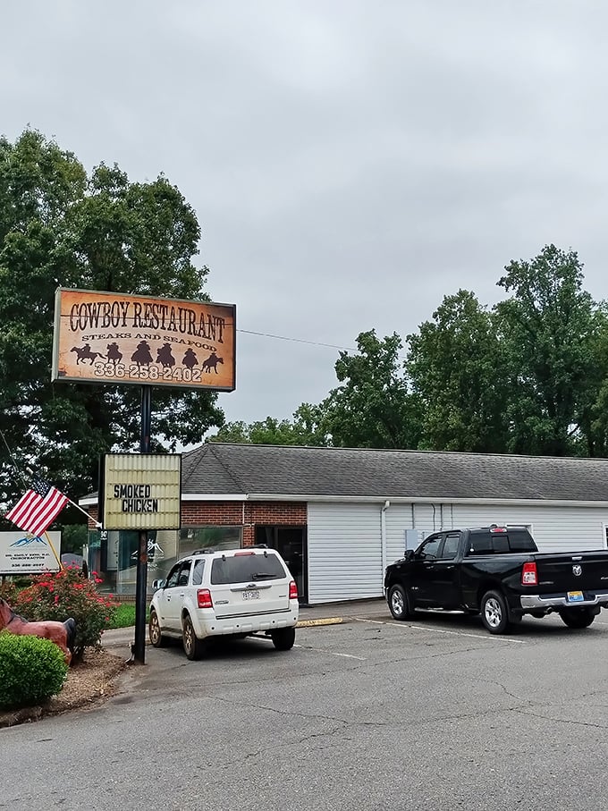 The Cowboy Restaurant sign promises exactly what you want after a day of exploring—hearty, no-nonsense food that sticks to your ribs and your memories.
