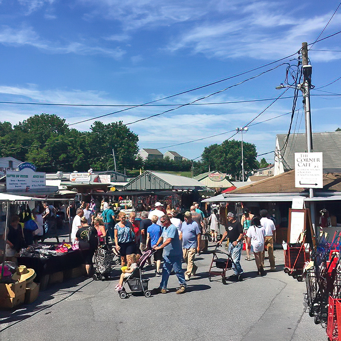 The market's bustling pathways create a human river of shoppers, each on their own quest for the perfect find.