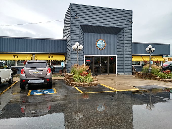 Drifters Restaurant welcomes hungry travelers with its distinctive blue exterior and nautical theme – a hint at the maritime delights waiting inside.