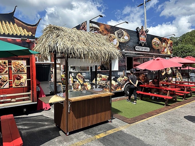 Food Truck Heaven isn't just marketing—it's a promise delivered with thatched huts, picnic tables, and global flavors that'll make you forget about theme park dining.