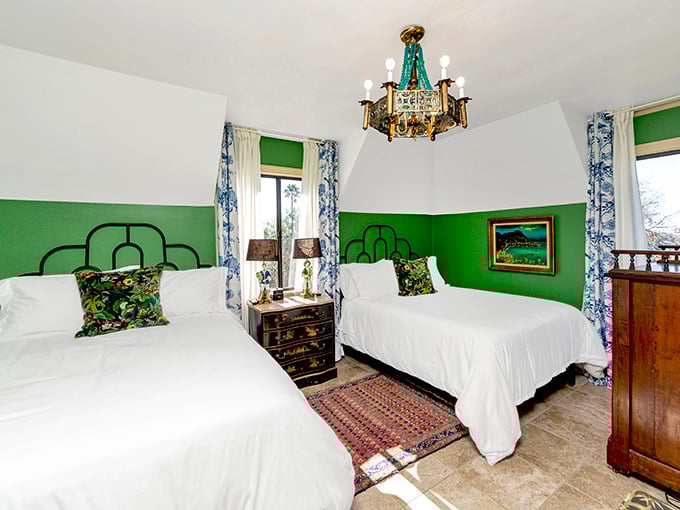 The green room's vibrant walls might make you feel like you're sleeping in a jewel box—albeit one with exceptionally comfortable beds.