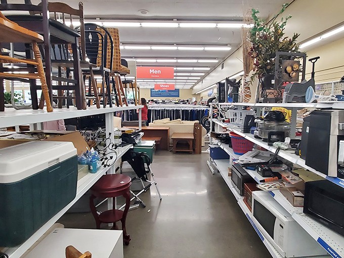 It’s not just the men’s section—it’s a treasure trove of microwaves, mismatched chairs, and mystery gadgets waiting for a second chance at greatness.