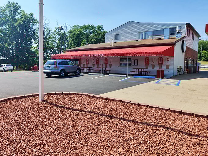 Sprankle's Ice Cream Pump isn't just a dessert spot—it's where summer memories are scooped fresh daily under that cheerful red awning.