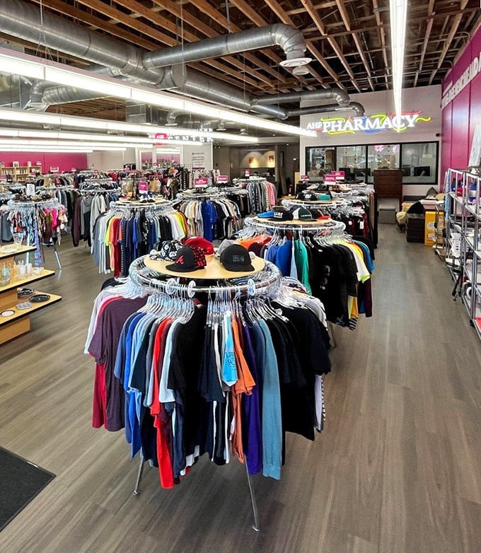 Treasure hunting made easy with circular racks organized by size and type. The industrial ceiling adds a modern edge to this thrifting paradise.