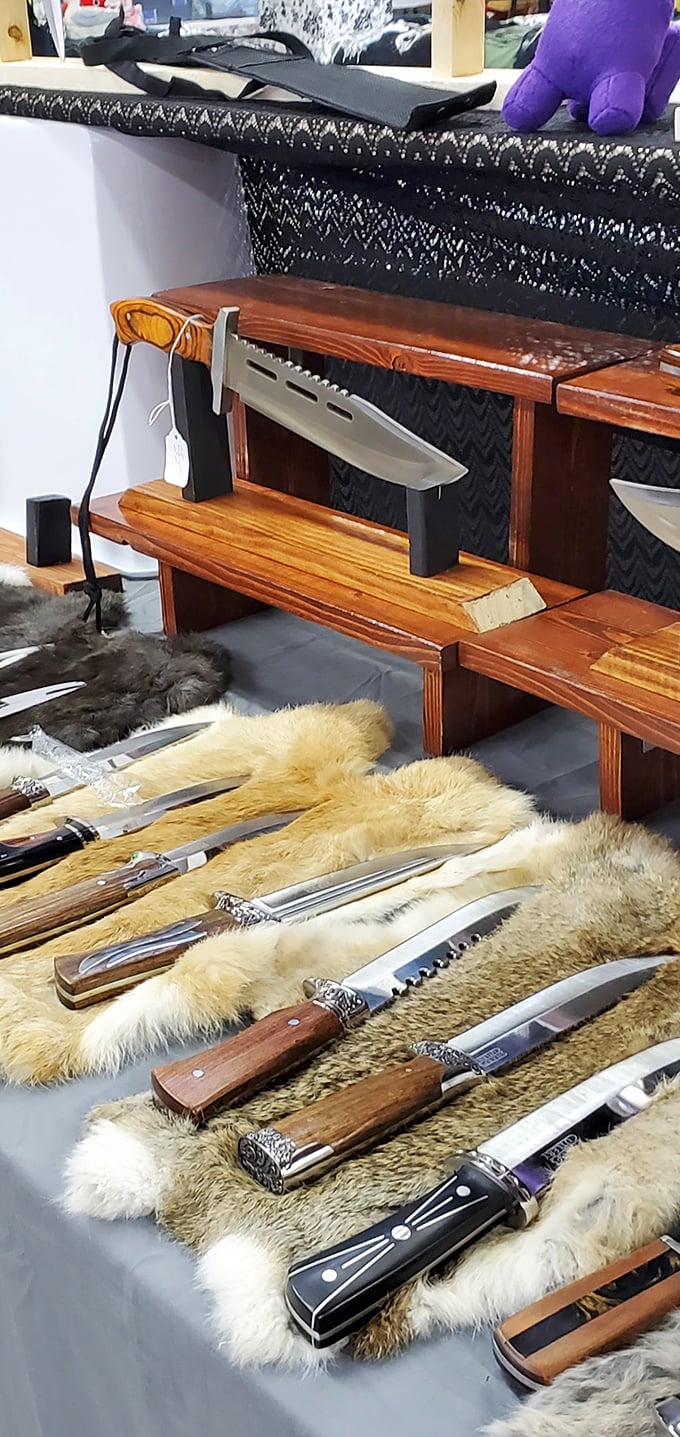 Sharp investments on display. These handcrafted blades rest on fur pelts, combining rugged craftsmanship with a dash of wilderness nostalgia.
