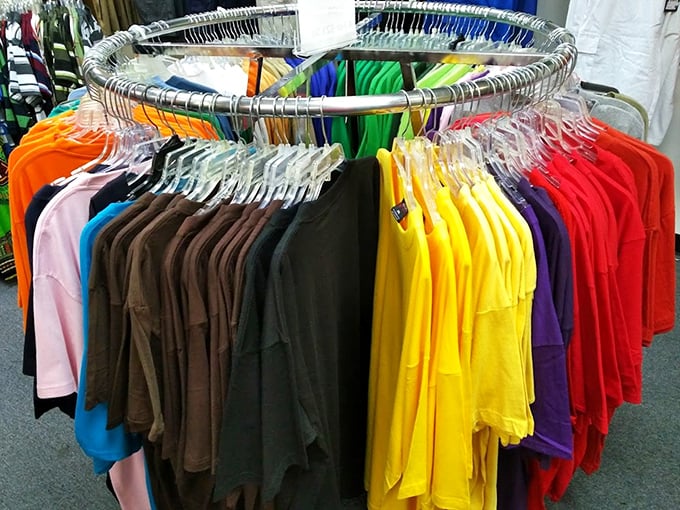 The circular rack of t-shirts offers a color wheel of possibilities—like a fashion roulette where every spin wins you comfort at outlet prices.