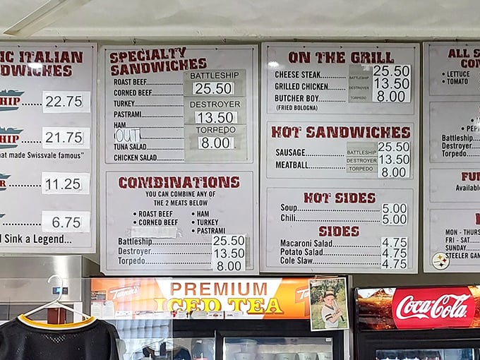 The menu board tells you everything you need to know—this isn't a place for dainty appetites. When sandwiches are named after warships, you know you're in for a battle.