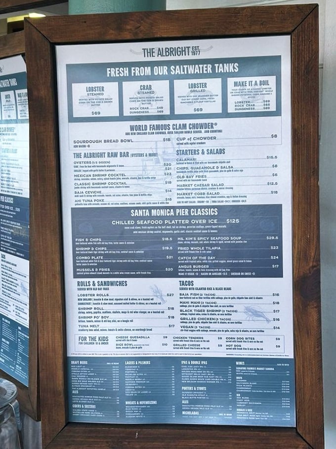 The menu board—a treasure map where X marks the lobster roll. Study it carefully, but we all know why you're really here.
