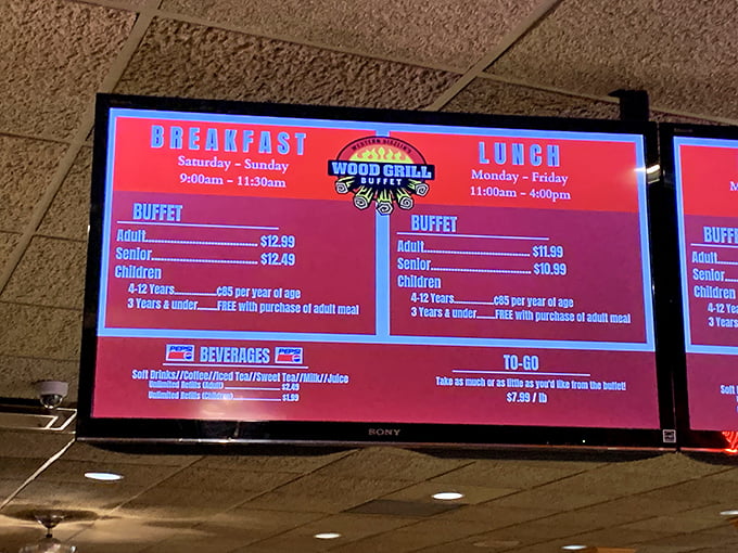 The digital menu board tells a simple truth: breakfast, lunch, and dinner await, with kids under 3 eating free—parents everywhere just perked up.