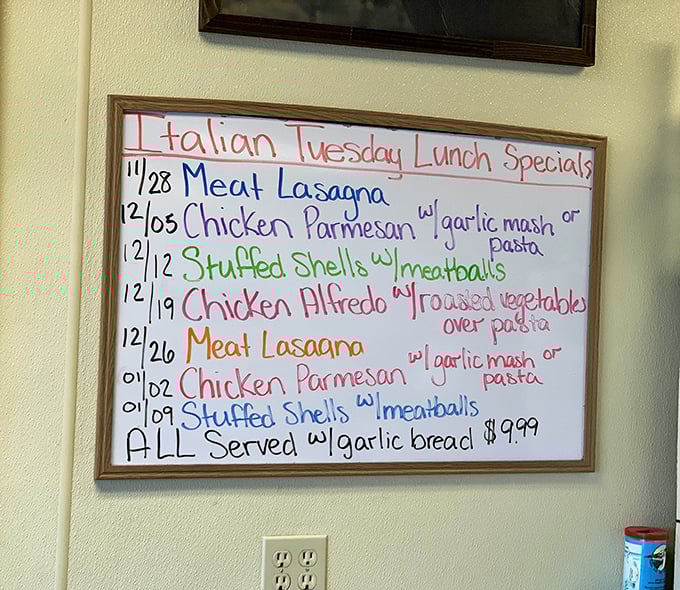 Italian Tuesday specials board – where comfort food gets a Mediterranean vacation. Garlic bread included, food coma optional.