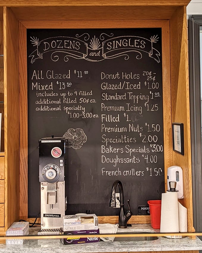 This chalkboard menu isn't just listing prices—it's offering a roadmap to happiness, one delicious donut decision at a time.