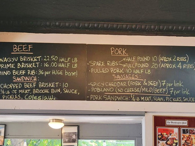 A menu board that reads like poetry to meat lovers. Each chalk-scrawled offering represents hours of patience and wood-fired devotion.