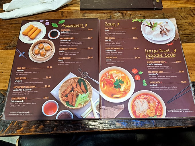 This isn't just a menu—it's a passport to flavor country. Each colorful page promises authentic Thai adventures that'll make your taste buds think they've booked a flight.