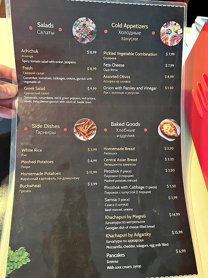 A menu that speaks two languages tells you everything: this place isn't playing around. The Cyrillic script promises authenticity that Instagram filters can't fake.