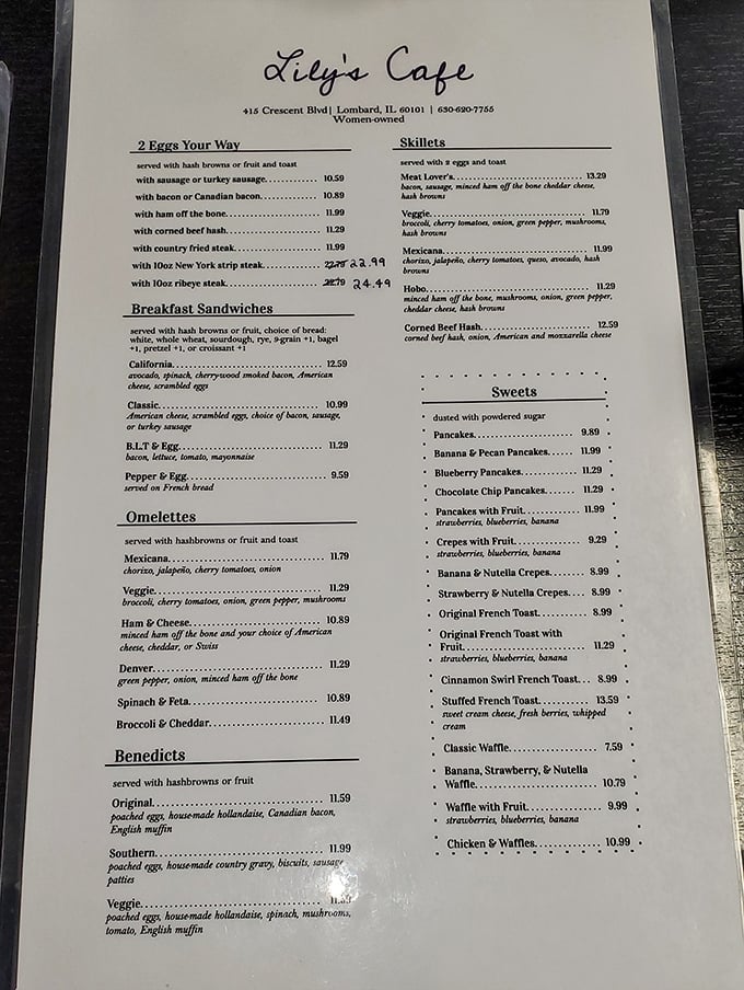 A menu that reads like a love letter to breakfast classics. That "ham off the bone" listing isn't just words—it's a promise of pork perfection.