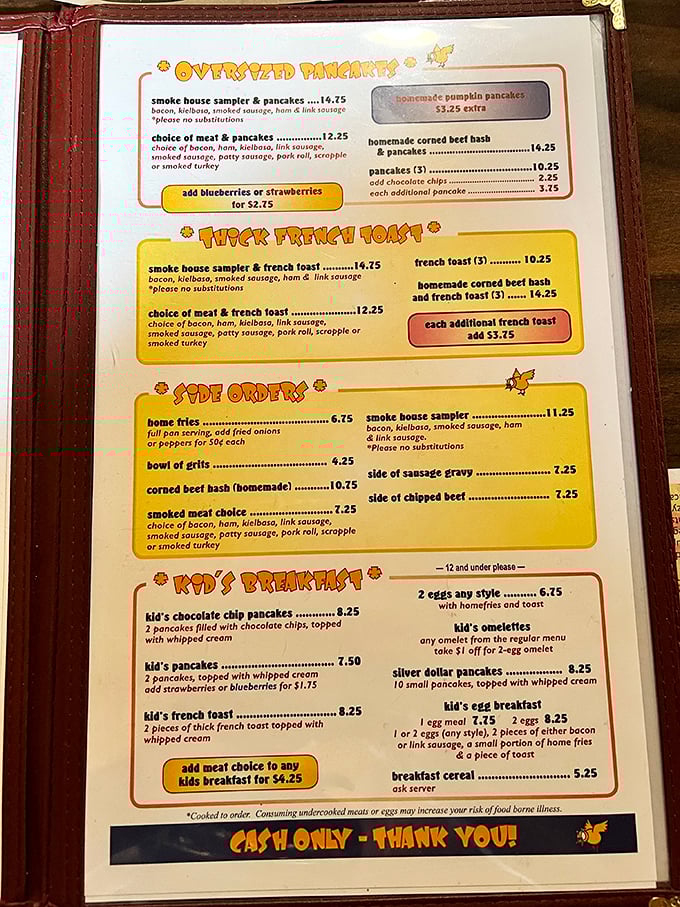 This menu isn't just a list of options—it's a treasure map to breakfast paradise. The "Oversized Pancakes" aren't false advertising!