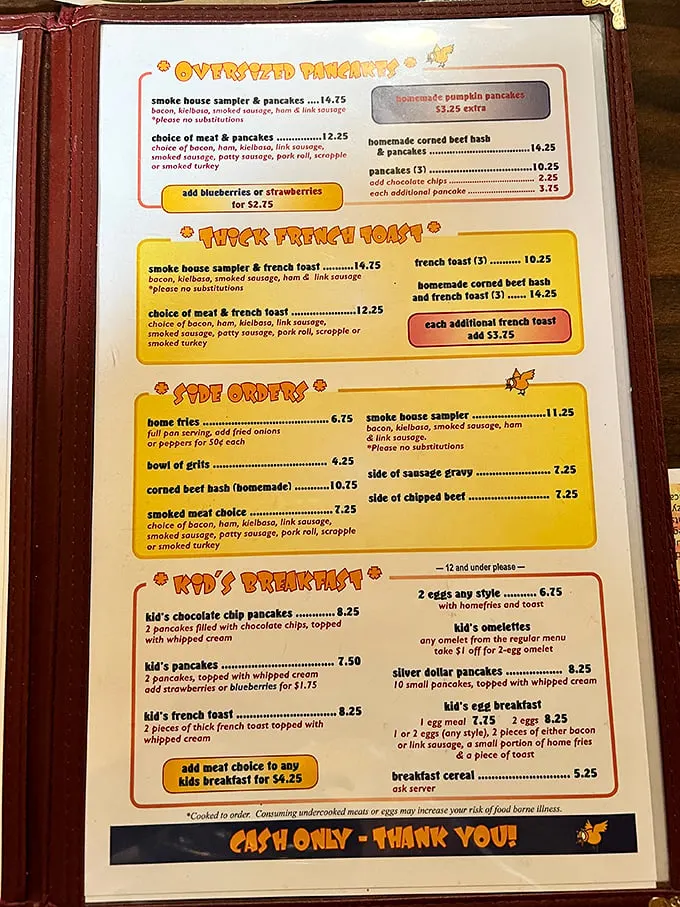 This menu isn't just a list of options—it's a treasure map to breakfast paradise. The "Oversized Pancakes" aren't false advertising!