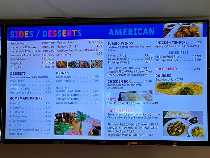 The menu board reads like a love letter to Caribbean cuisine, with each item promising a vacation for your taste buds.