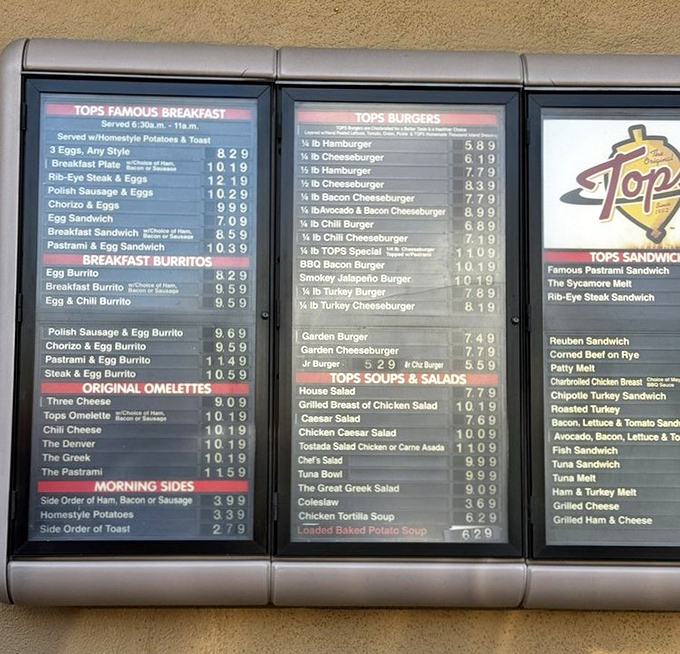 The menu board – a sacred text for regulars who've memorized it anyway but still scan it like they're seeing possibilities for the first time.