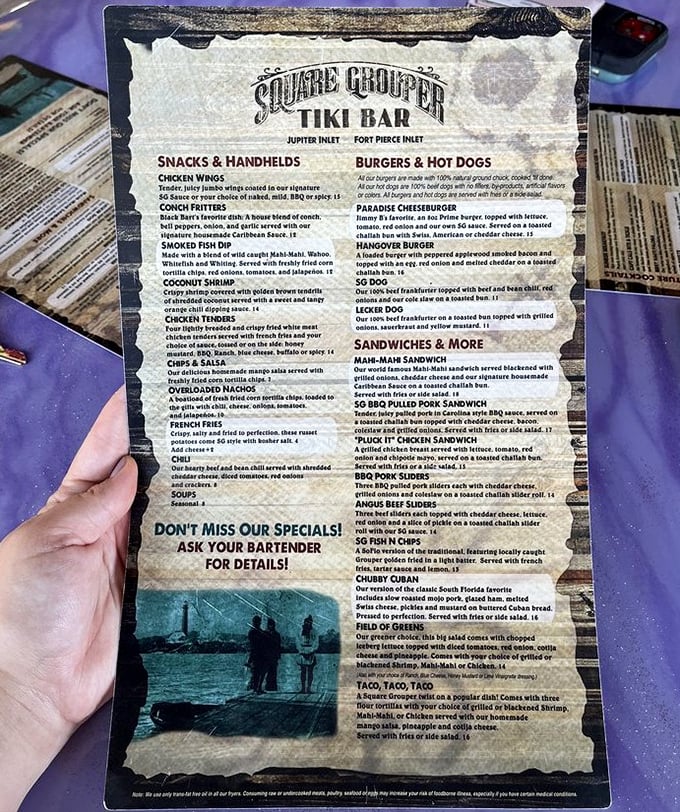 A menu that reads like a love letter to Florida's waters – conch fritters, smoked fish dip, and blackened mahi that would make Jimmy Buffett write another verse.