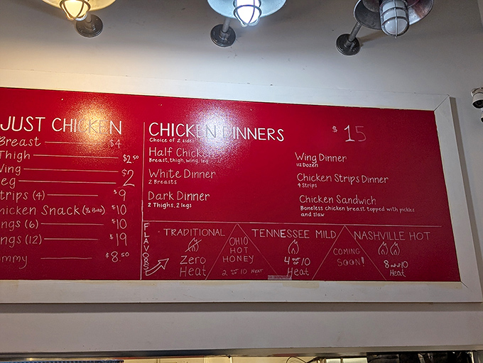 The menu board speaks a universal truth: good chicken doesn't need fancy descriptions, just heat levels ranging from "grandma-approved" to "you'll-need-a-moment."