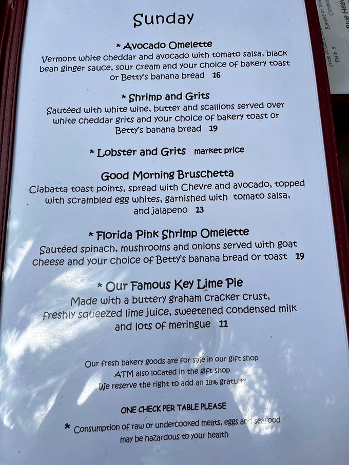 This menu reads like a love letter to Key West cuisine—where else can you find lobster and grits sharing space with Betty's banana bread?