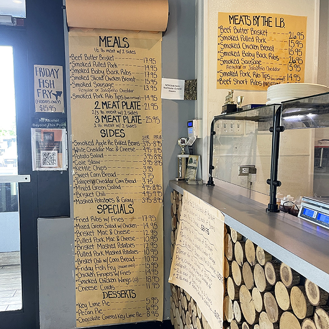 That handwritten menu board is BBQ's version of a love letter – promising smoky delights and sides that refuse to be mere afterthoughts.