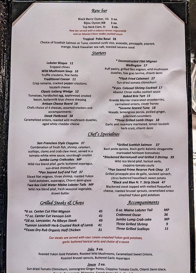 A menu that reads like a love letter to seafood and steak lovers—notice that lobster bisque right at the top of the starters? Not a coincidence.