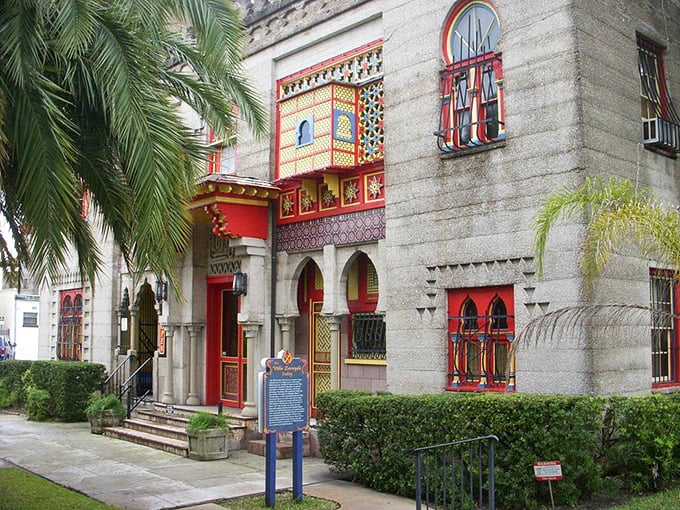 Palm trees frame this Moorish fantasy like nature's exclamation points. The red-trimmed windows and horseshoe arches aren't just design choices—they're love letters to the Alhambra.