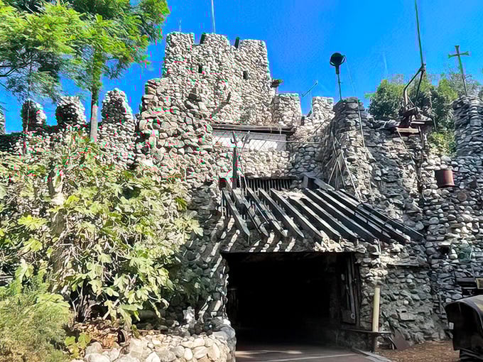 Medieval meets industrial in this stone fortress doorway. The wooden chevron entrance looks like it could withstand a siege—or at least a door-to-door salesman.