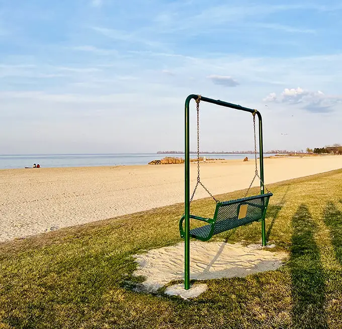 The lakeside swing offers both a seat and a metaphor—pause, sway, and take in the vastness of Caesar Creek's sandy shoreline.