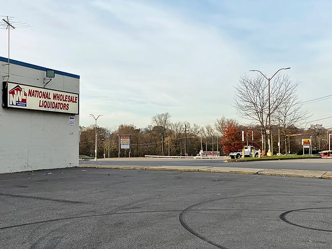 From this angle, National Wholesale Liquidators looks almost modest—until you step inside and discover the warehouse wonderland of discounts within.