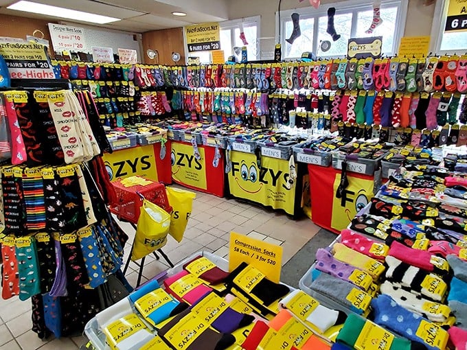 A sock lover's paradise! Every pattern imaginable hangs in this colorful display – because life's too short for boring feet.
