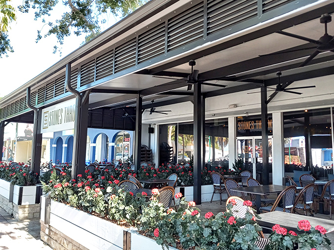 Stones Throw serves up Mediterranean vibes with Florida flair. Those flowers aren't just pretty—they're plotting to make you order dessert.
