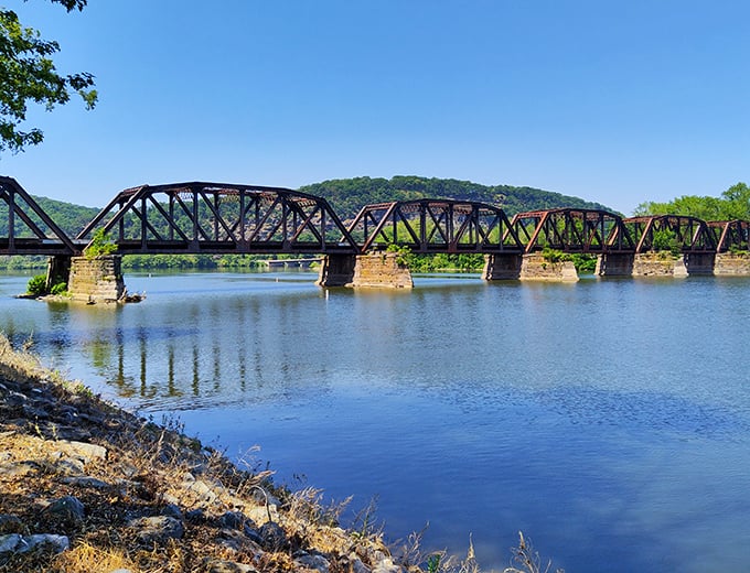 This historic iron bridge isn't just functional—it's a time machine to Pennsylvania's industrial past, standing proud against the serene river backdrop.