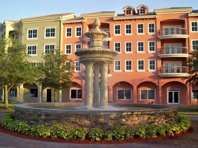 This elegant fountain stands like a Mediterranean sentinel, guarding the entrance to a world where Florida meets the Italian Riviera.