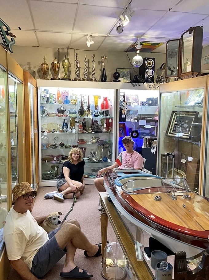 Even the four-legged treasure hunters approve of this nautical find—a meticulously crafted wooden boat that would make any lake house proud.
