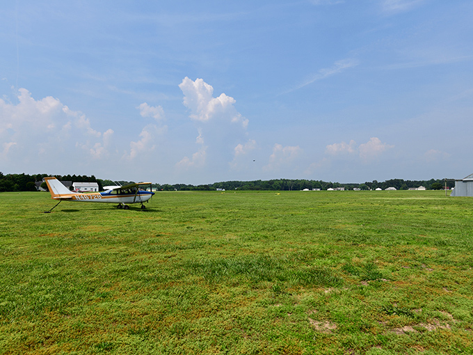 Not all flying objects at this location are unidentified. A small aircraft rests on the grassy airfield near where the Futuro House has "landed."