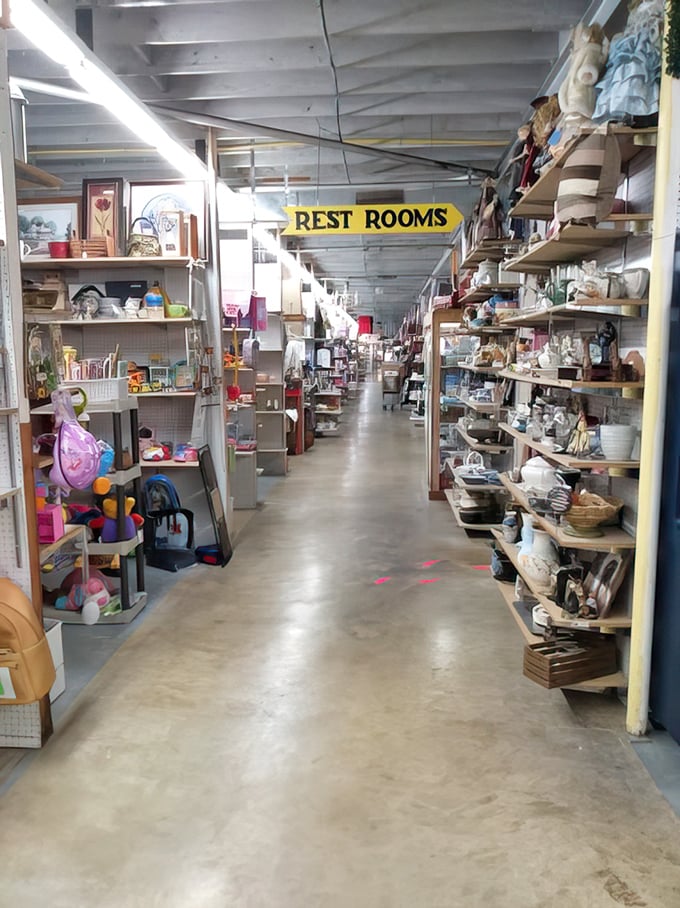 The "REST ROOMS" sign might be the most straightforward thing in this labyrinth of memories and merchandise stretching as far as the eye can see.