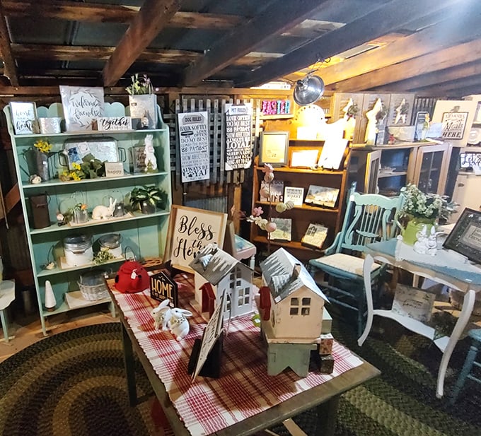 Farmhouse chic before it was trendy! This corner vignette showcases how vintage signs and distressed furniture create instant character in any home.