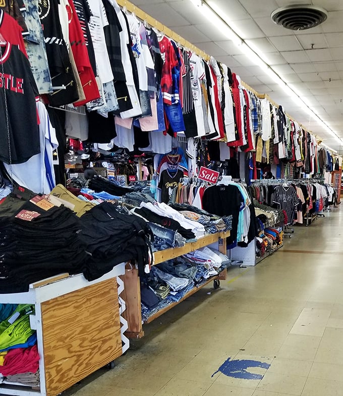 A textile wonderland where t-shirts hang like colorful stalactites, each one waiting to tell its story at a fraction of mall prices.