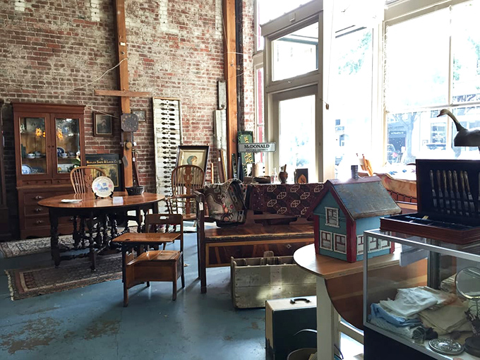 Exposed brick walls create the perfect backdrop for antique furniture and collectibles. History doesn't just sit here—it invites you in.