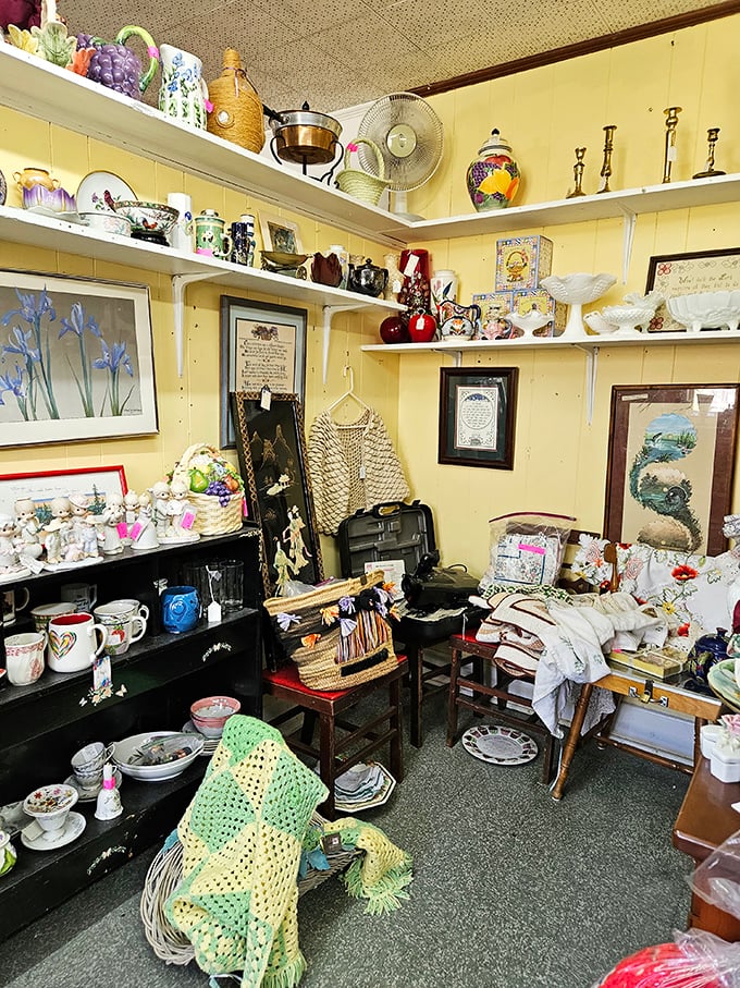 Every shelf tells a story in this yellow-walled booth. That crocheted throw has probably witnessed more history than most history books.