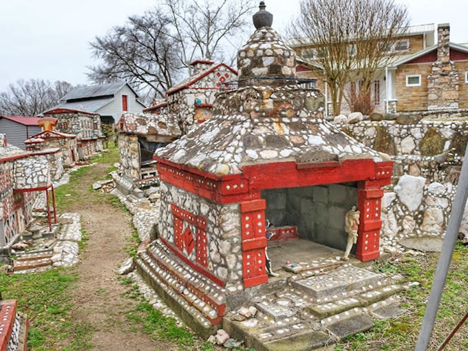 This ornate stone pavilion with its striking red accents looks like it could be the town hall for the world's most sophisticated squirrels.