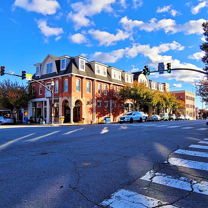 The Aethelwold Hotel Building commands its corner with Victorian-era confidence, its warm brick exterior housing modern businesses in a perfect blend of past and present.