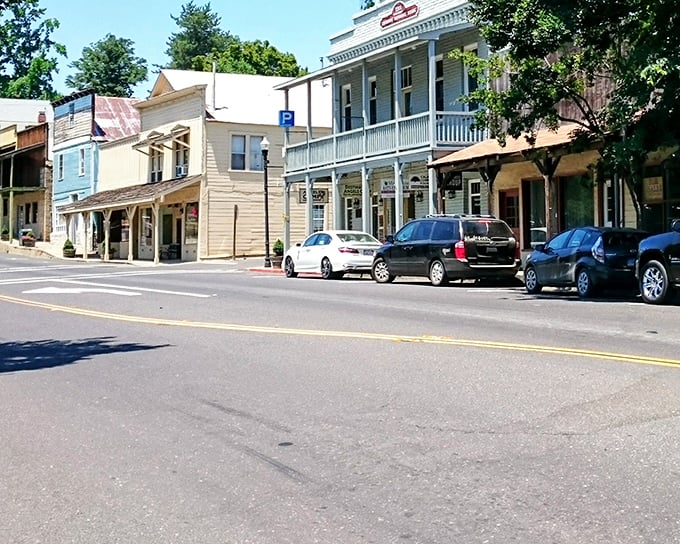 Historic storefronts line the sun-dappled streets, creating the kind of downtown where you half-expect to see Mark Twain himself strolling by.