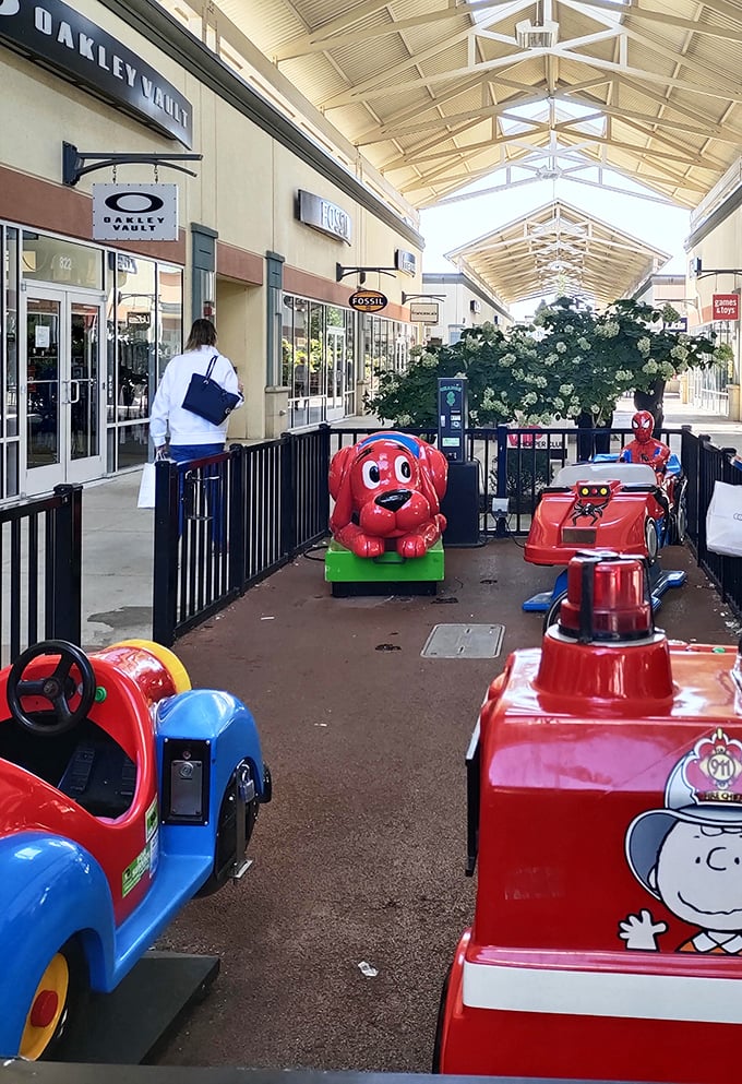 Kid-friendly ride-on attractions strategically placed between stores—because nothing says "I can shop longer" like happy, occupied children.