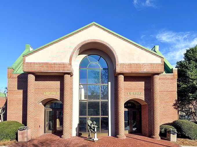 The Beaufort Library welcomes bookworms with its grand arched entrance. A temple of knowledge where air conditioning meets literary adventure.