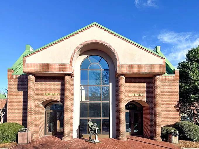 The Beaufort Library welcomes bookworms with its grand arched entrance. A temple of knowledge where air conditioning meets literary adventure.