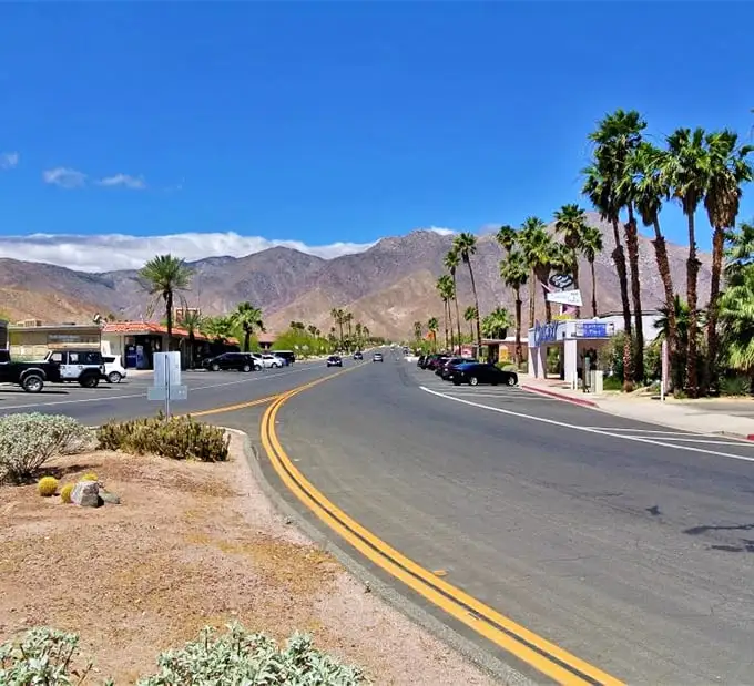 Blue skies, palm trees, and mountains that don't quit – Borrego Springs' main street is California desert living without the pretension or price tag.